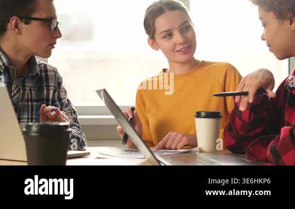 Focused female team leader discuss financial statistics brainstorming ...