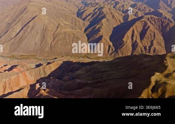 Aerial view captures dramatic eroded sandstone mountains in Kyrgyzstans ...