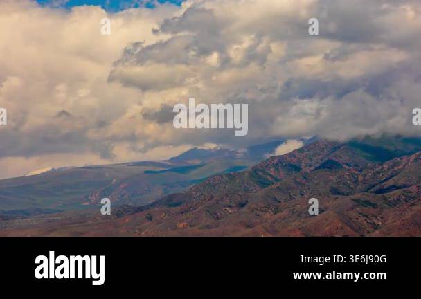 Static camera time-lapse of mountain landscape in Kyrgyzstan. Clouds ...