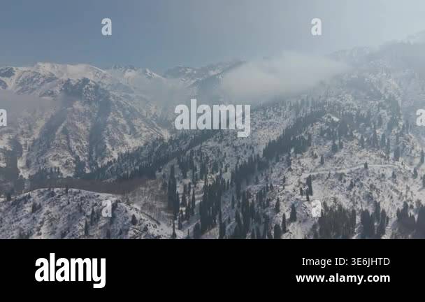 Almaty, Kazakhstan - March 28, 2026: Aerial view of snow-covered ...