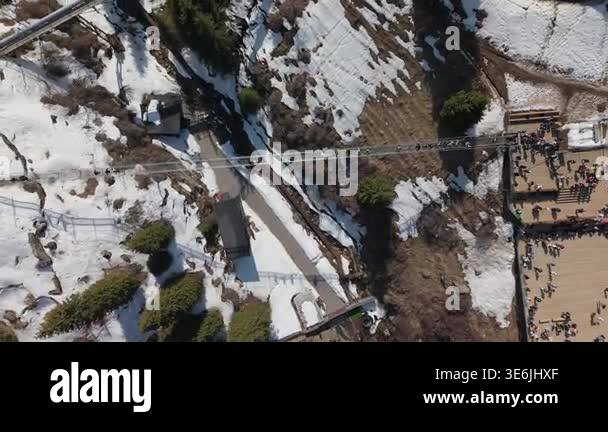 Almaty, Kazakhstan - March 28, 2026: Aerial shot captures a snowy ...