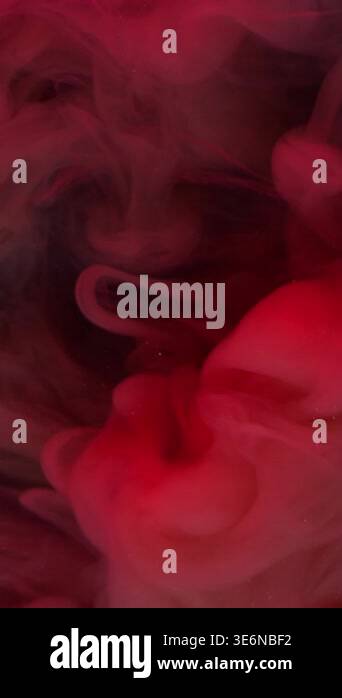 Vertical video. Dye splash. Color smoke. Defocused pink purple blue ...