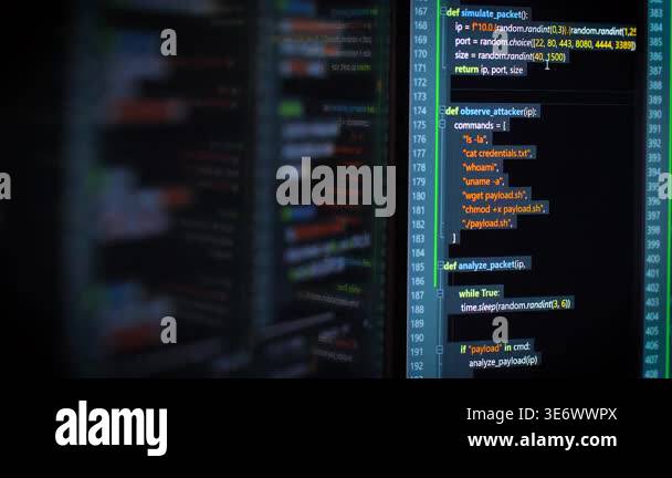 Close up computer monitors displaying fictional programming code and ...