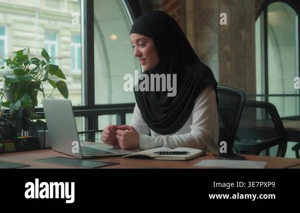 Muslim islamic business woman in hijab positive talking with laptop has ...