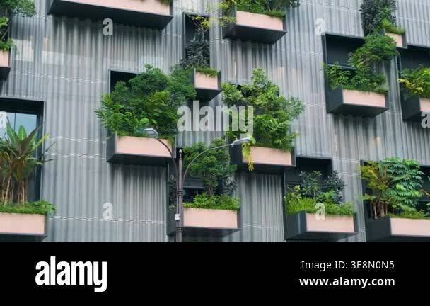 Modern building facade with integrated vertical garden and planter ...