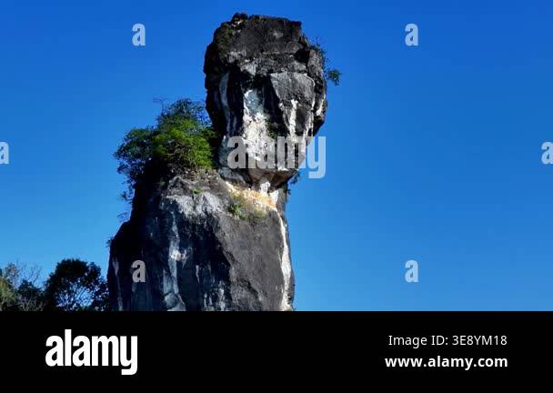 A striking photograph capturing a prominent, weathered rock formation ...