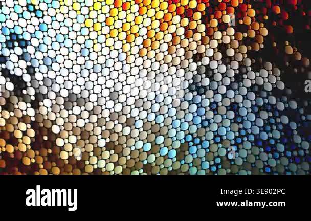 Abstract animation featuring a wave of colorful glowing dots shifting ...