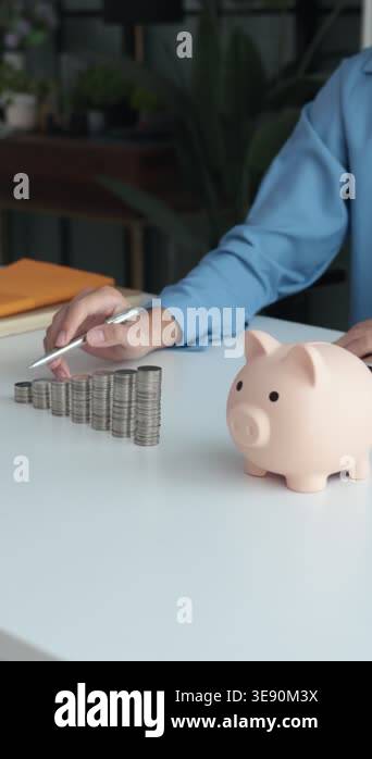Businessman counting on growing money stacks and piggy bank on the ...