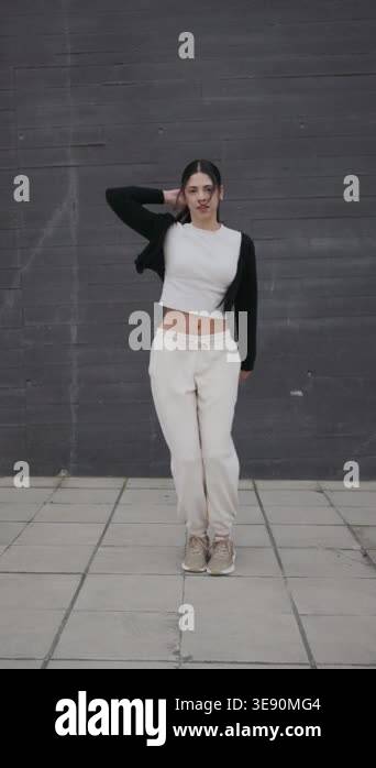 Young woman performing a hip hop and afrobeat dance choreography in an ...