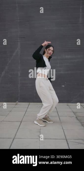 Energetic female dancer performing a contemporary afrobeat and hip hop ...