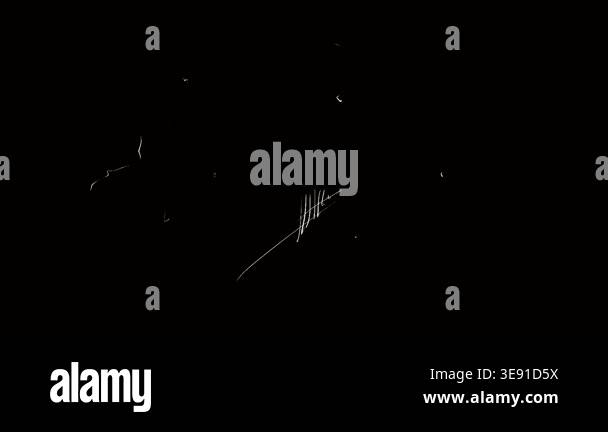Drawing strokes of retro animation with white rough lines on black ...