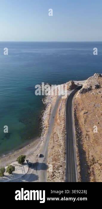Aerial drone view of coastal road in Rhodes Greece with cliffs and blue ...
