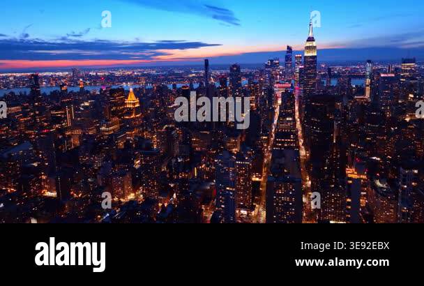 Amazing panorama of iconic Manhattan at night. Drone footage above New ...
