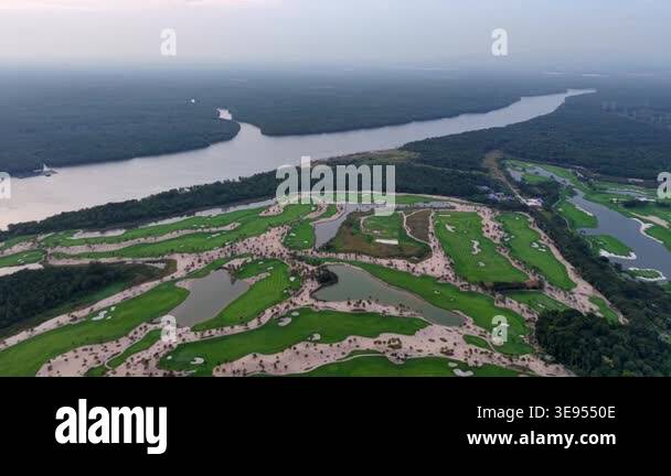 Drone aerial view showcasing golf course layout, lakes and surrounding ...