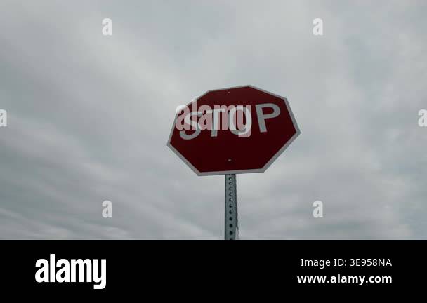Stop sign in urban environment signaling drivers to halt at ...