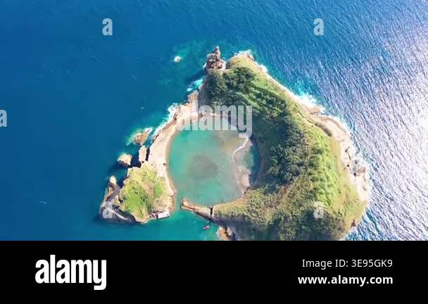 Aerial view of Ilheu de Vila Franca do Campo volcanic crater island off ...