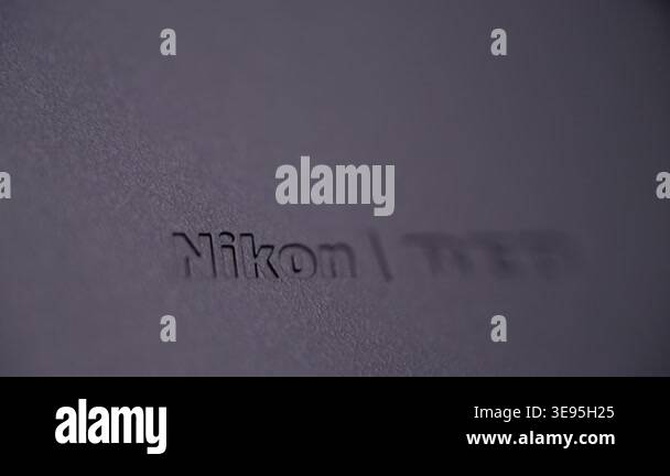 A close look at the Nikon ZR mirrorless camera shows the brand logo on ...
