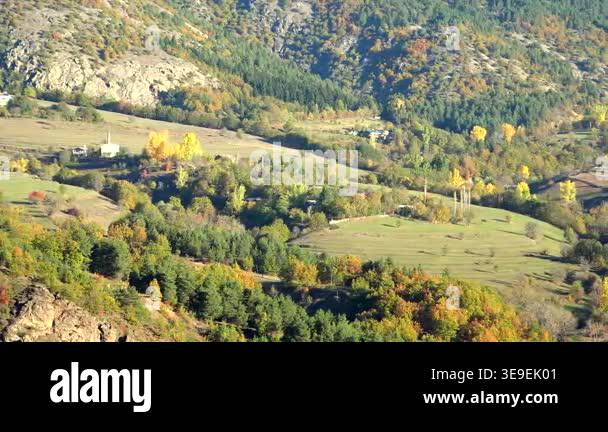 Traditional homes sit in an Artvin valley, surrounded by meadow, forest ...