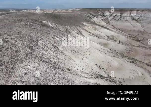 aerial badlands desert valley limestone hills soil terrain gullies ...