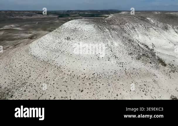 barrow aerial tumulus treeless hill burial mound oval terrain hilly ...