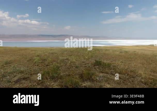 Aerial views of Tuz Golu show salt flats, barren fields, and broad ...