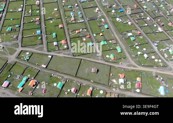 Urban housing districts in Mongolia form a colorful city grid of roofs ...