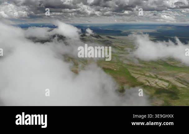 Aerial view shows treeless steppe grasslands plus vast open plains ...