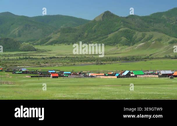 Colorful Houses of a Russian Town in Forest and Meadow By River in ...