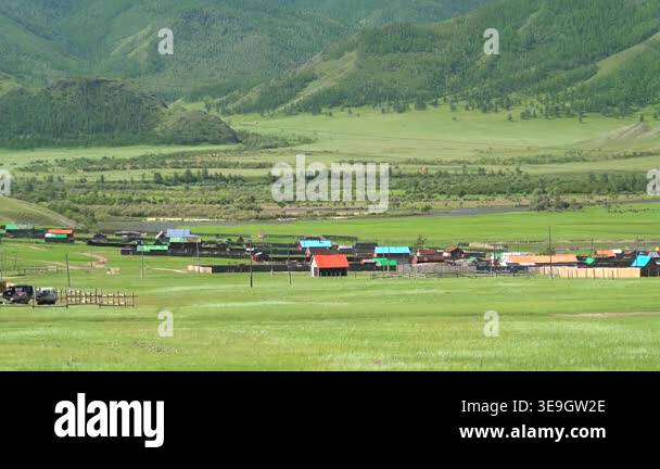 Colorful Houses of a Russian Town in Forest and Meadow By River in ...