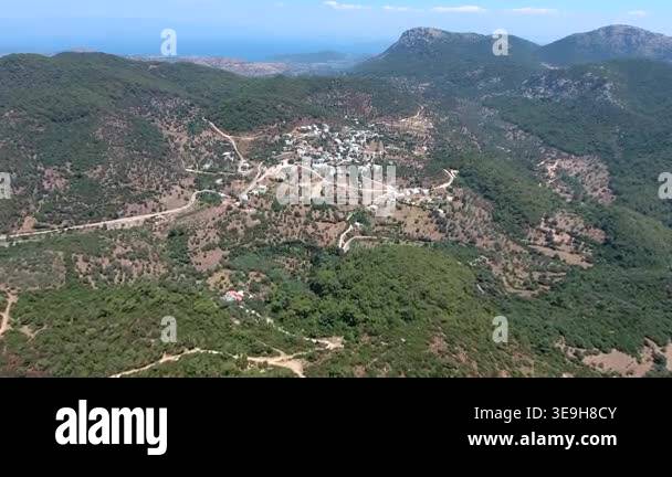 Aerial coastal view shows shoreline relief, blue water, and bright ...