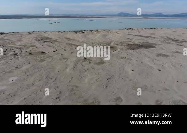 Aerial view shows sand barrier between sea and coastal lagoon beneath ...