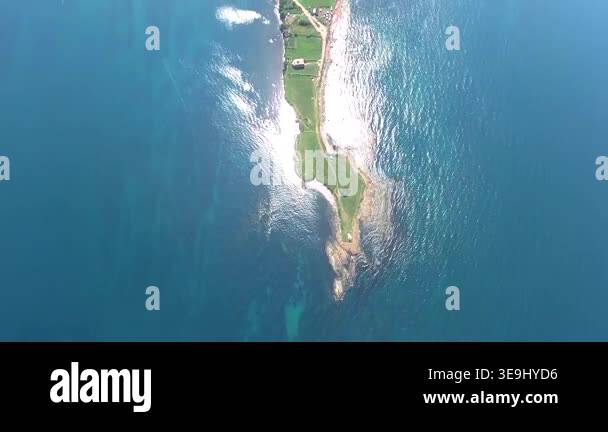 Panoramic aerial view of elongated promontory peninsula extending into ...