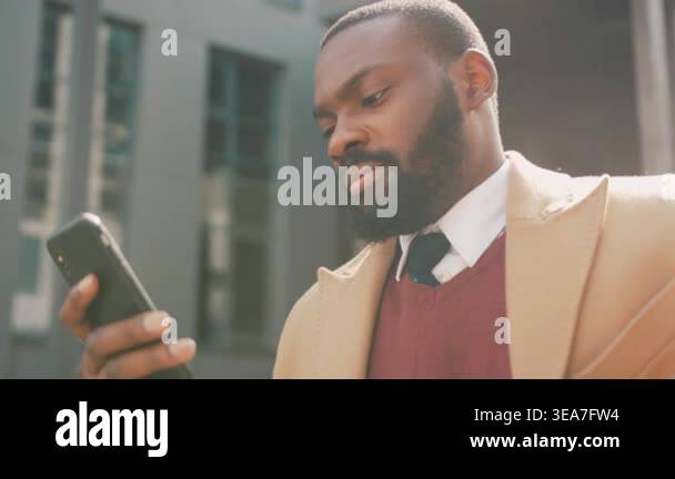 businessman checking phone on city street, executive reading email ...