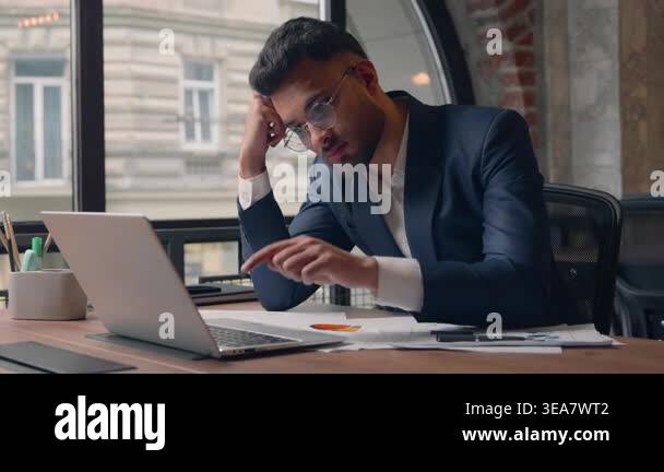 Arabian businessman Indian melancholy frustrated business man typing ...
