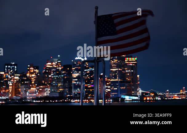 Selective focus of US flag with blurred NYC skyline. Close-up of ...
