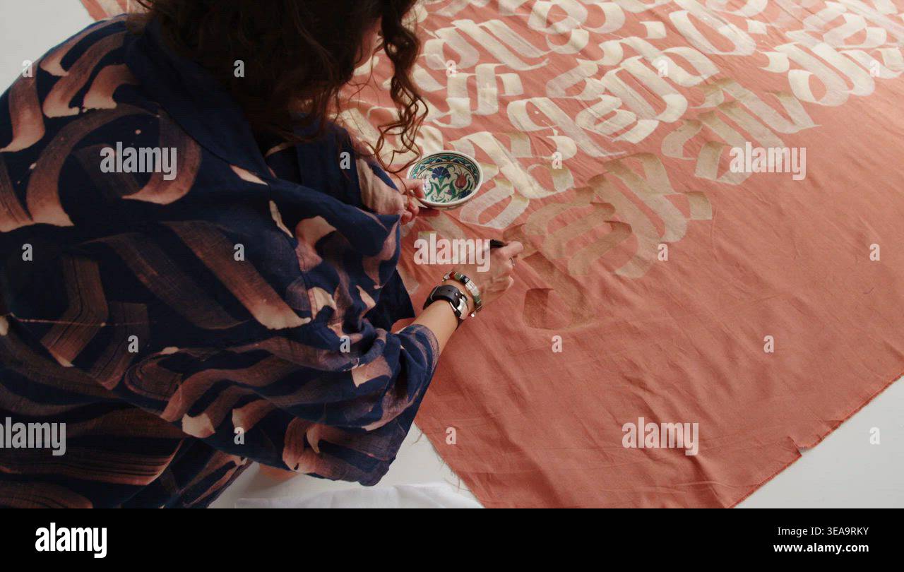 Artistic fabric design process featuring hand-painted lettering styles ...