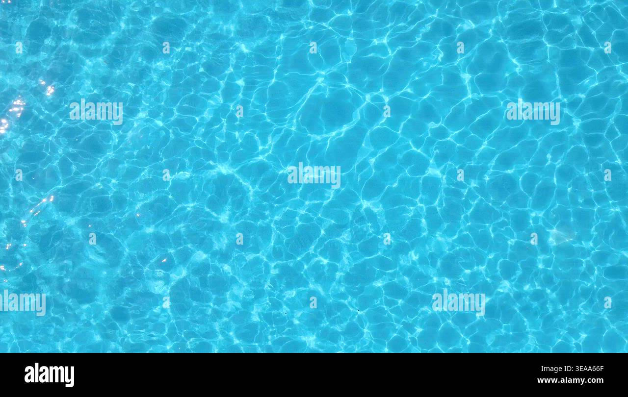 Transparent blue water catching sun reflection Stock Video Footage - Alamy