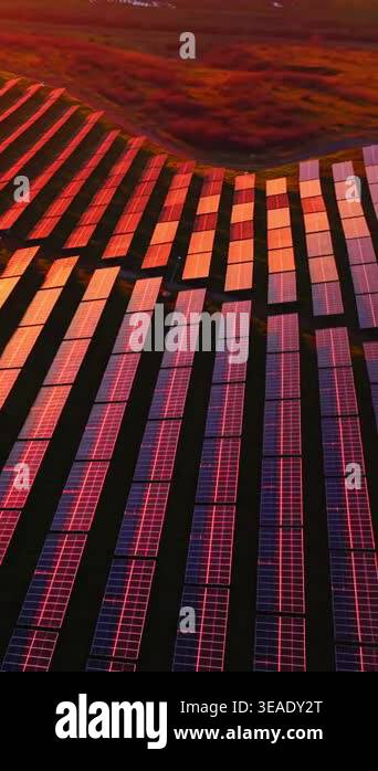 High angle view of photovoltaic arrays on a hilly landscape under ...