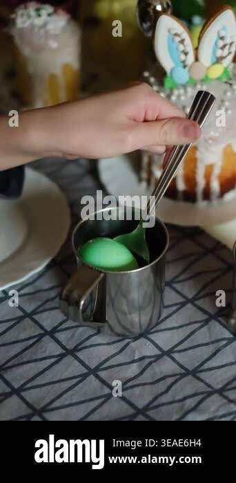 The process of dyeing an Easter egg pink. The background features ...