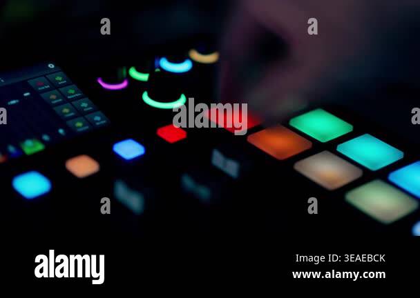 DJ sampler controller glowing pads finger pressing music production ...
