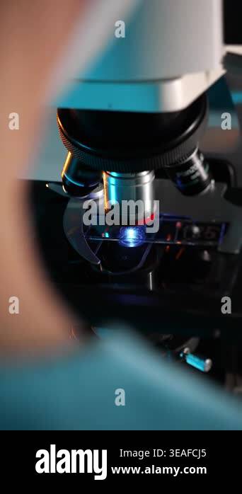 Close up of microscope analyzing biological sample in laboratory ...