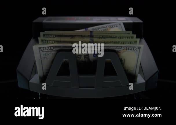 Close-up of a money counting machine sorting and counting one hundred ...