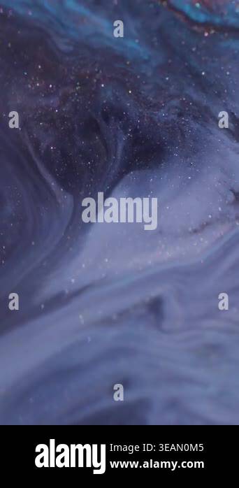 Vertical video. Blur spilling fluid. Paint texture. Defocused blue ...