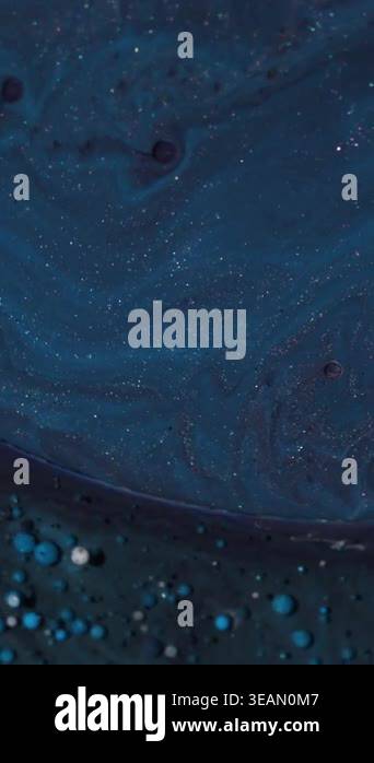 Vertical video. Sparkling bubbles. Paint background. Defocused purple ...