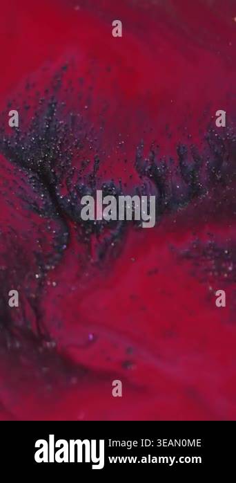 Vertical video. Shiny fluid. Bokeh art. Blur red purple color ink ...