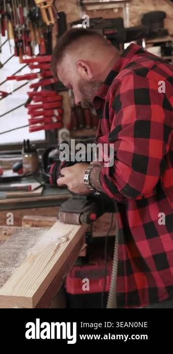 Vertical video. Carpenter occupation. Joinery process. Bearded man ...