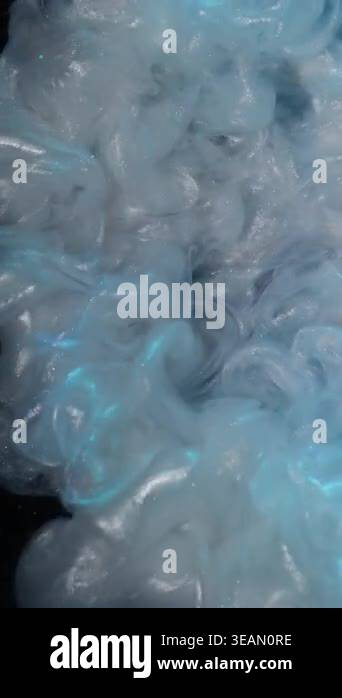 Vertical video. Glitter cloud. Paint water. Defocused blue color ...