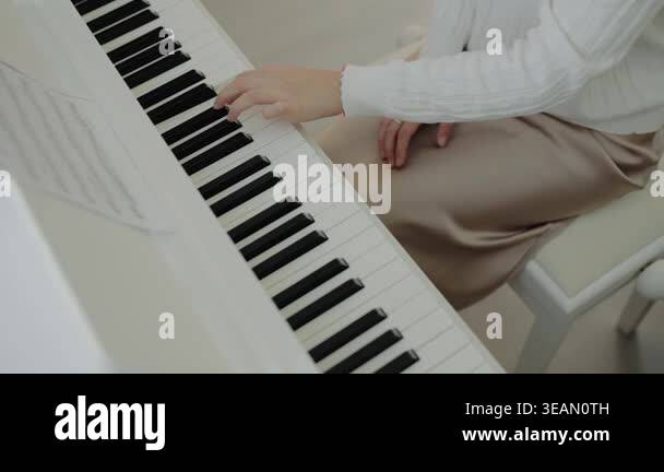 Focused young cute girl having fun playing electric piano. Musician ...