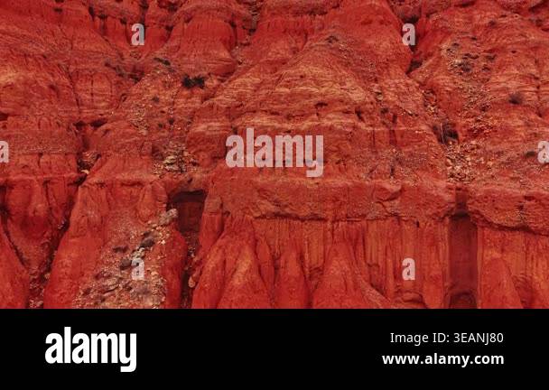 In Spain, unique rock formations display bright red colors and distinct ...
