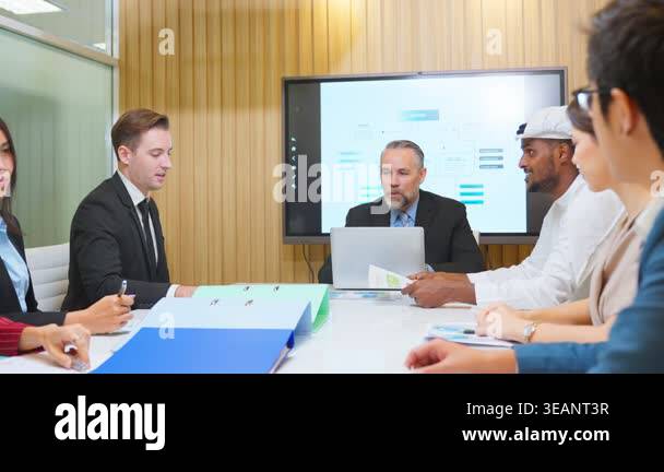 professionals discussing strategies in a modern conference room with a ...